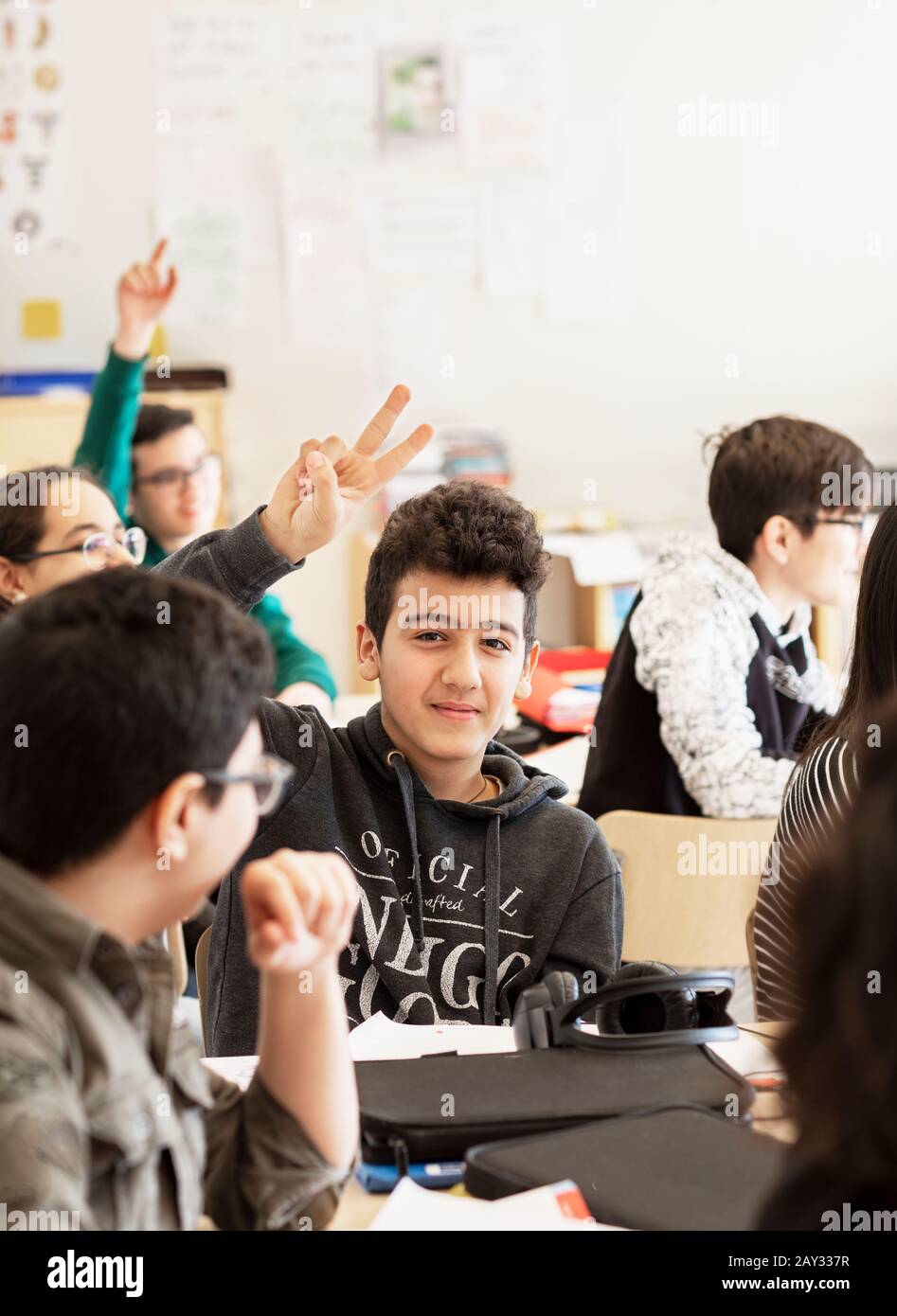 Teenage boy showing peace sign Stock Photo - Alamy