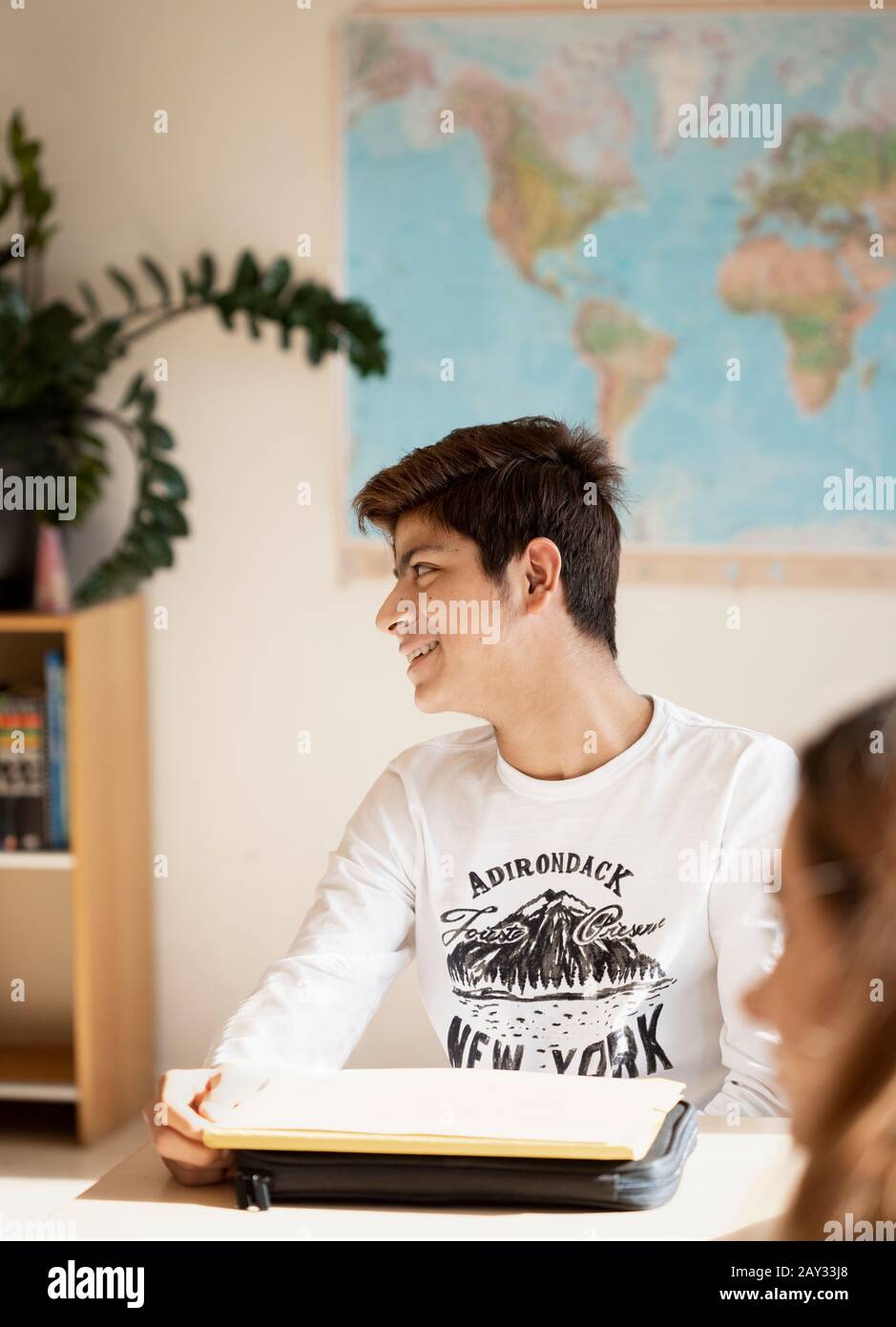 Teenage boy in classroom Stock Photo - Alamy