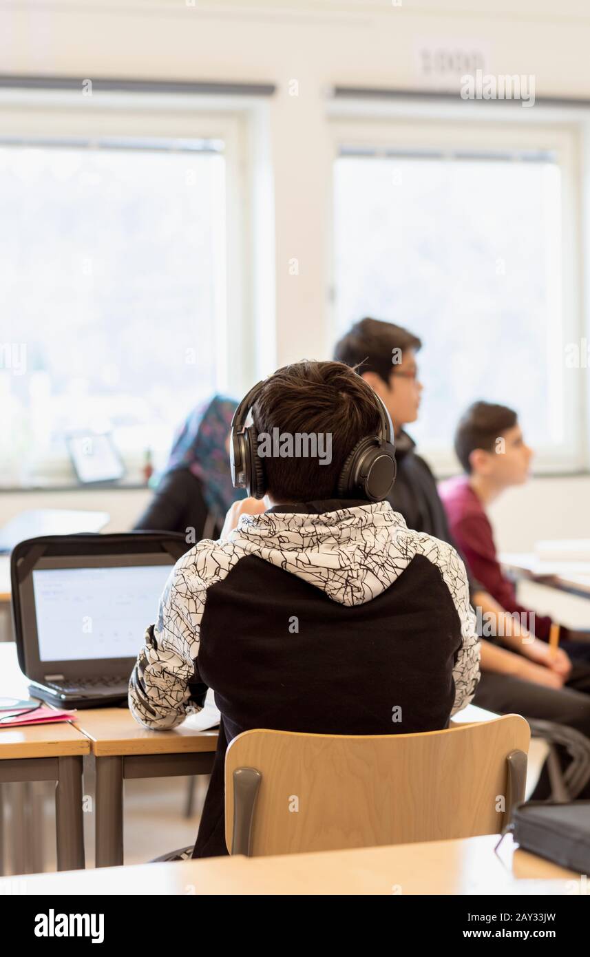 Teenager in classroom Stock Photo - Alamy