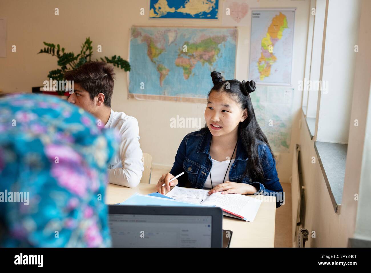 Teenagers in classroom Stock Photo - Alamy