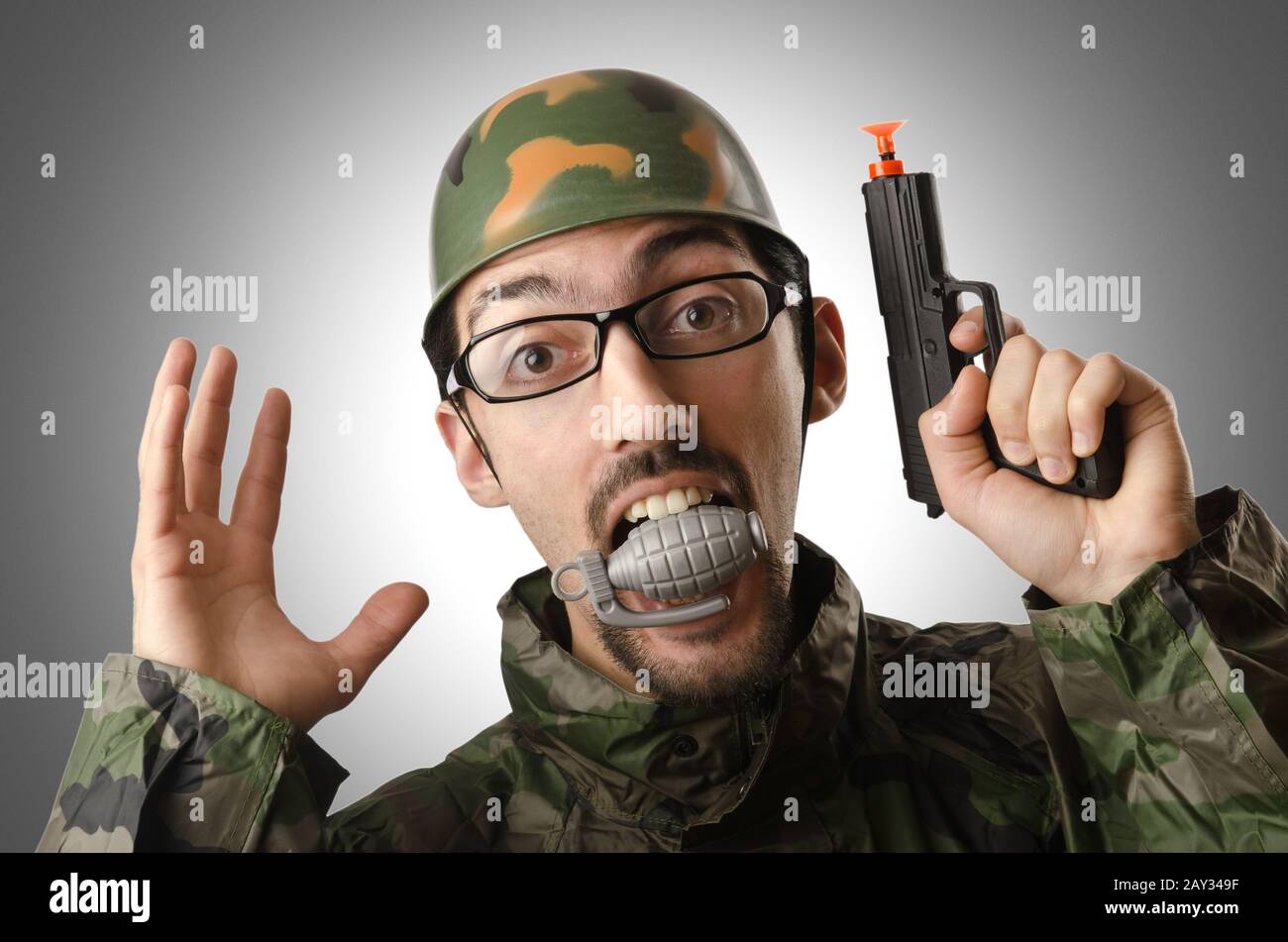 Funny soldier in humour concept Stock Photo - Alamy