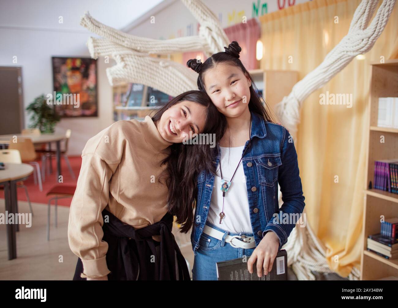 Teenage girls looking at camera Stock Photo - Alamy