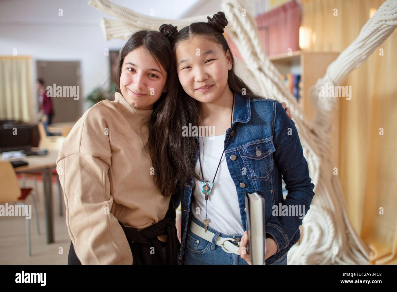 Teenage girls looking at camera Stock Photo - Alamy
