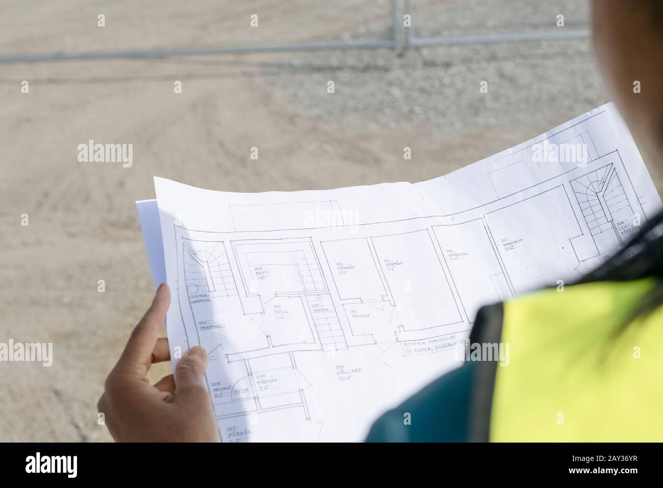 Person holding blueprint Stock Photo - Alamy