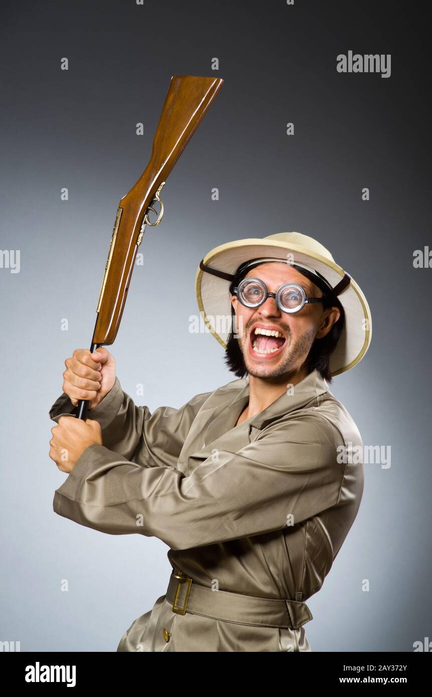 Funny safari hunter with rifle Stock Photo - Alamy
