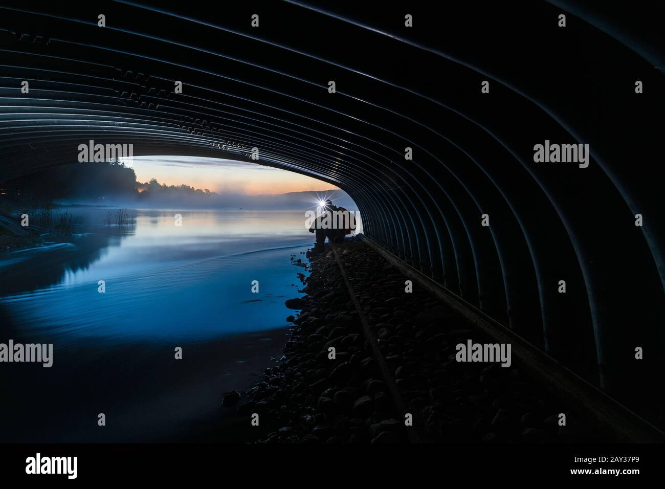 Man sitting under bridge hi-res stock photography and images - Alamy