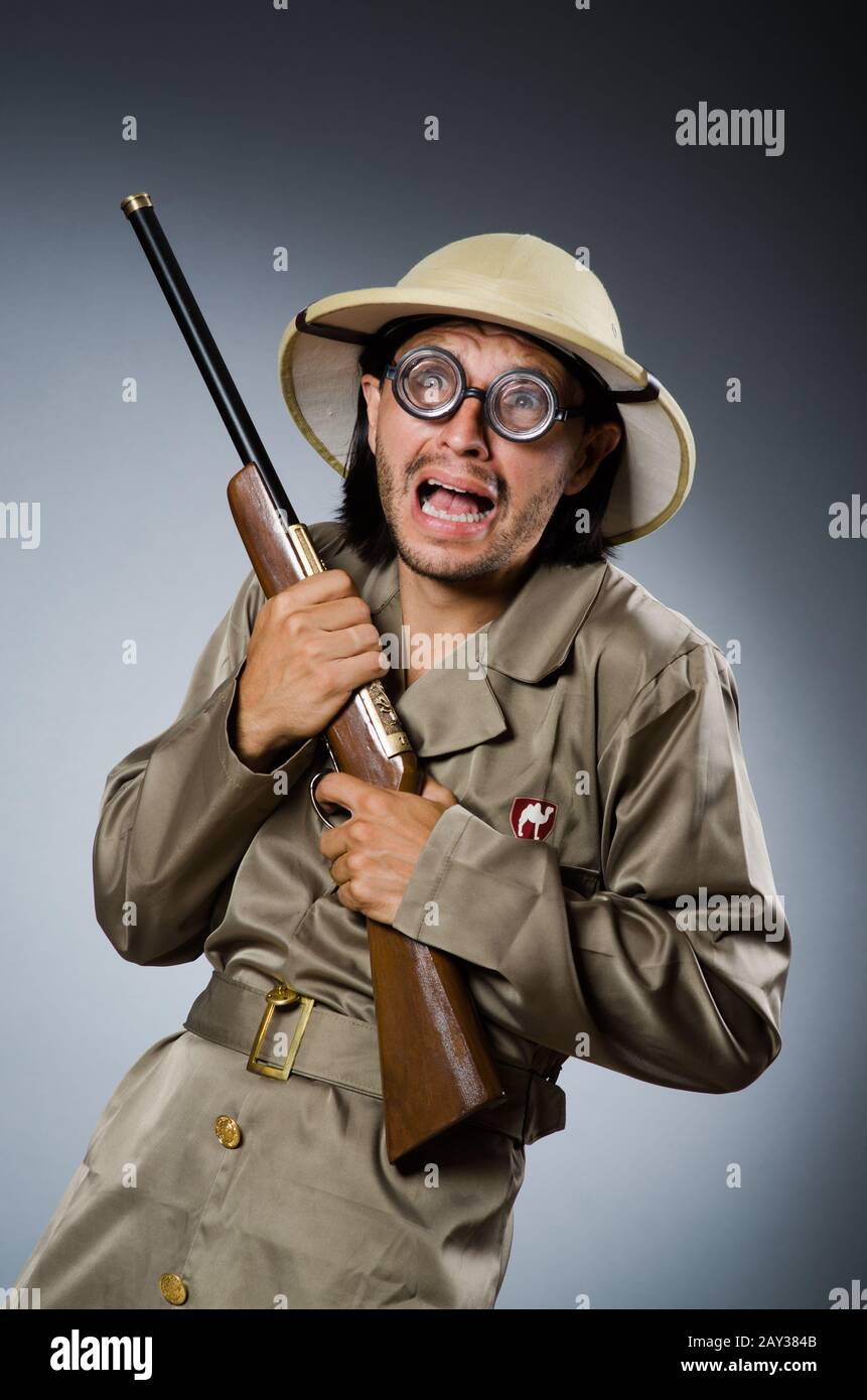 Funny safari hunter with rifle Stock Photo - Alamy
