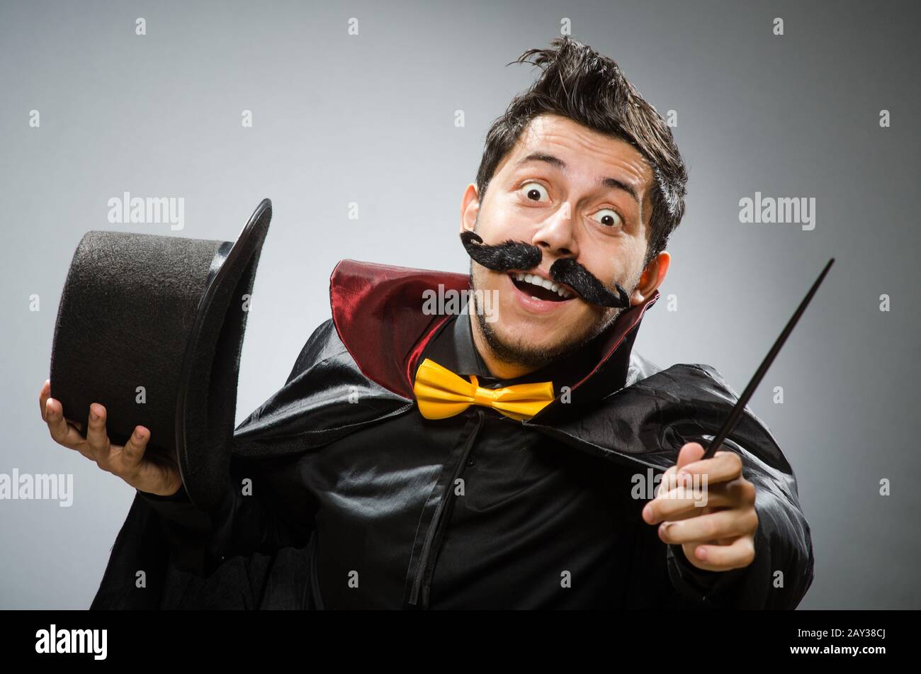 Funny magician man with wand and hat Stock Photo - Alamy