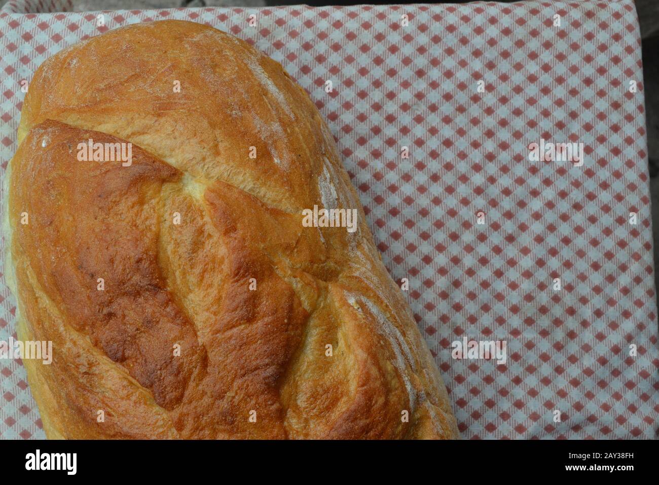 Bread. A loaf of bread. Freshly baked bread. Tablecloth. Delicious ...