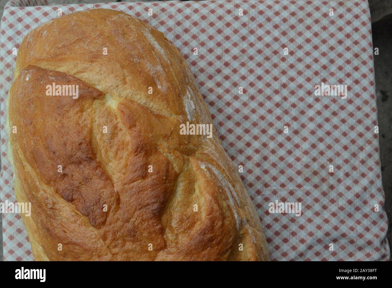 Bread. A loaf of bread. Freshly baked bread. Tablecloth. Delicious ...