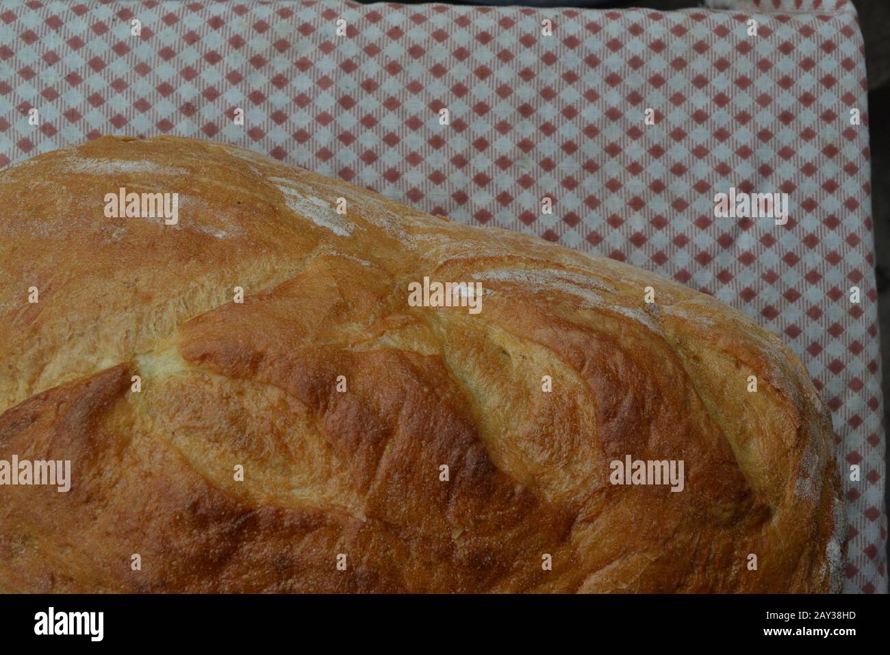 Bread. A loaf of bread. Freshly baked bread. Tablecloth. Delicious ...