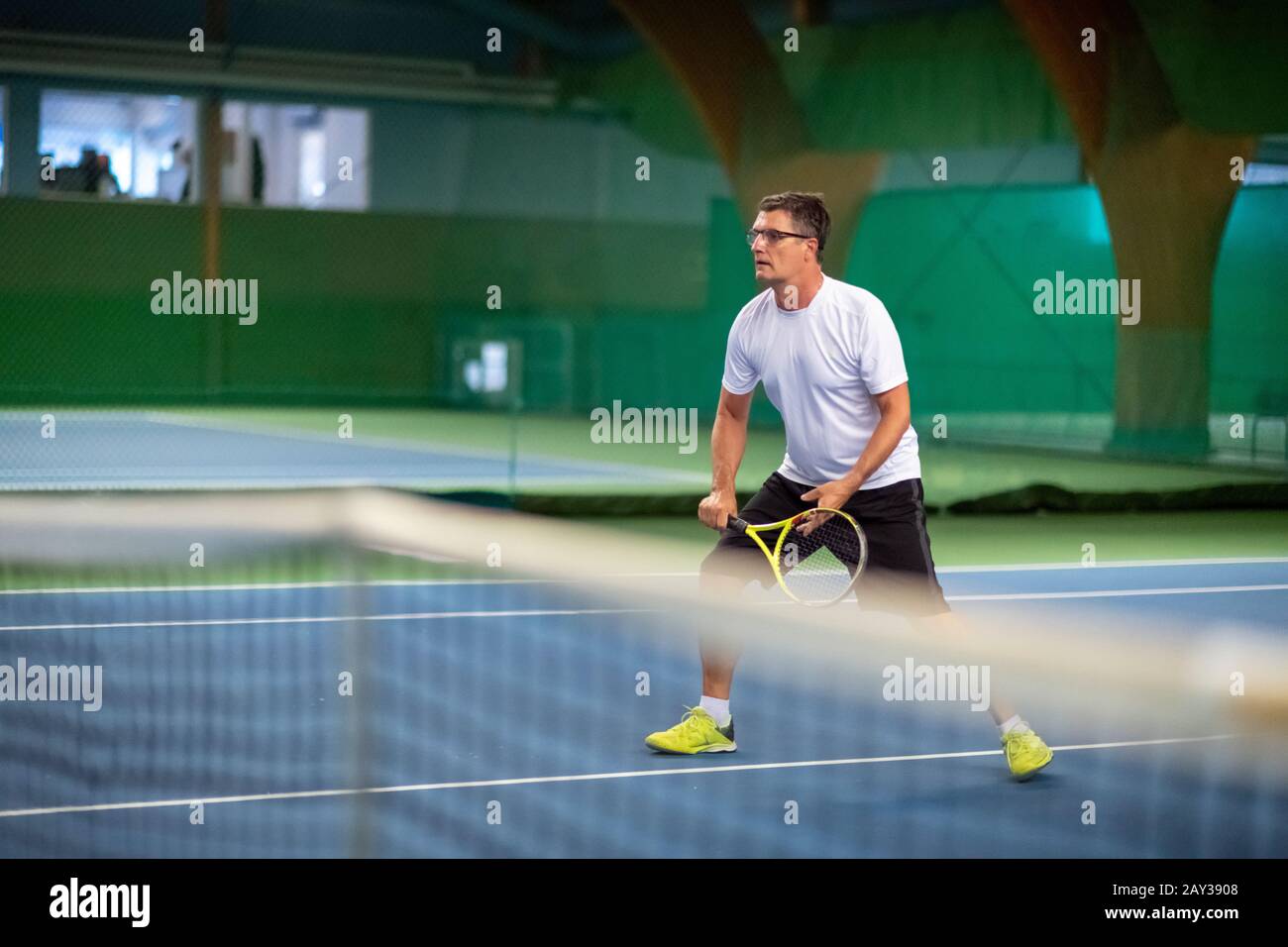 Man playing tennis Stock Photo - Alamy