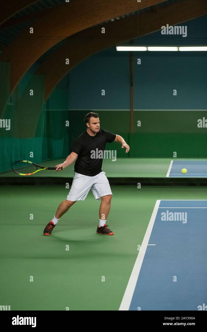 Man playing tennis Stock Photo - Alamy