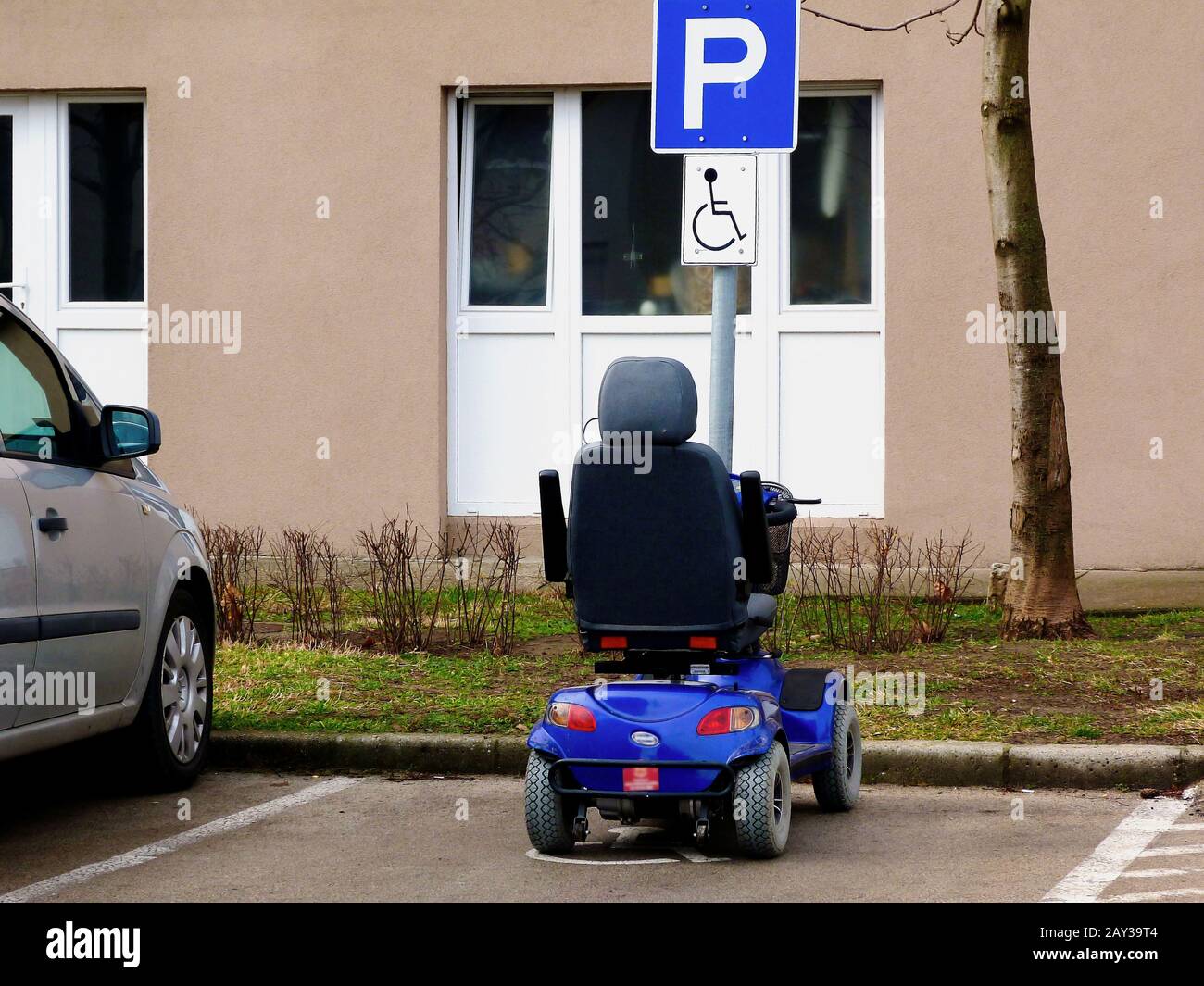 blue electric motorised disability or handicap scooter in handicap ...