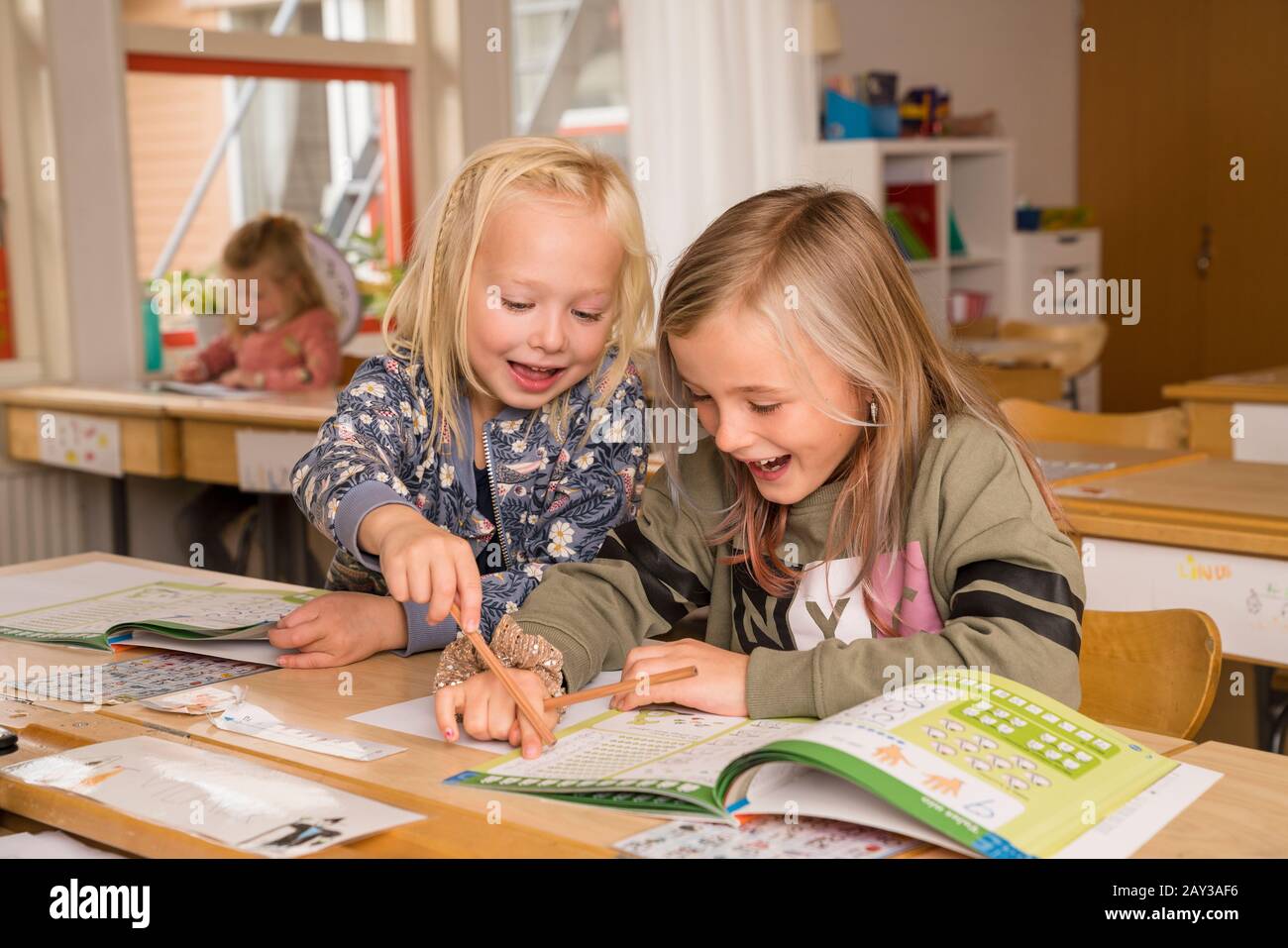 Girls in classroom Stock Photo - Alamy
