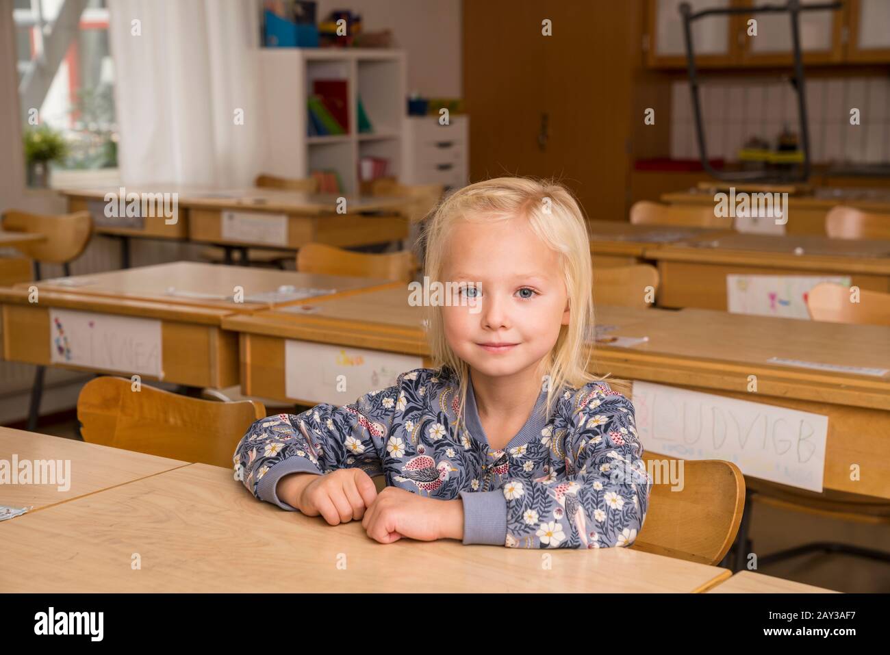 Smiling girl in classroom Stock Photo - Alamy