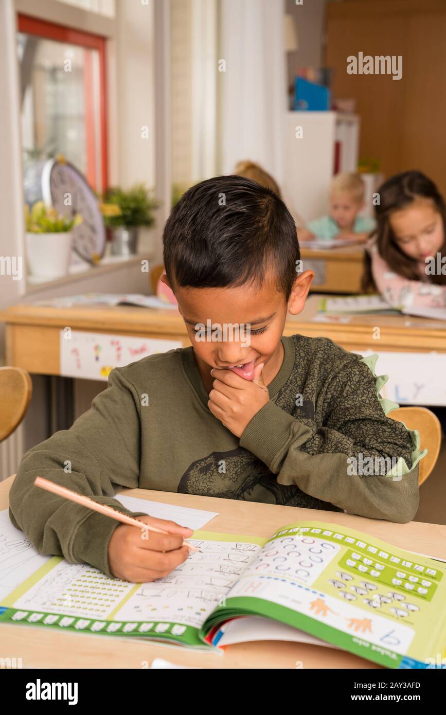 Boy in classroom Stock Photo - Alamy