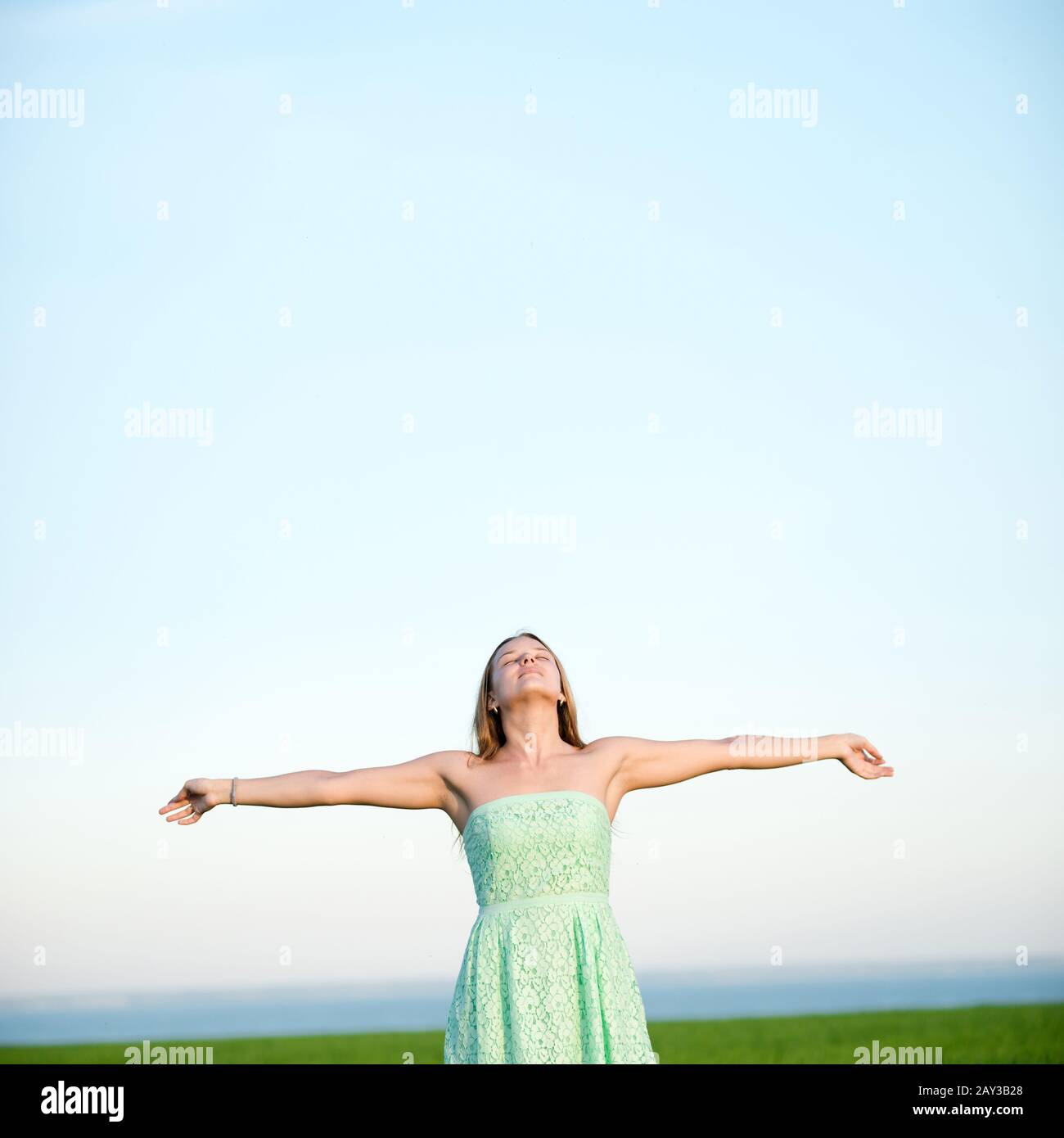 Happiness woman stay outdoor under sunlight of sunset Stock Photo - Alamy