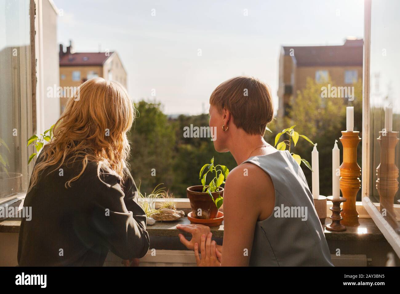 Women looking through window hi-res stock photography and images - Alamy