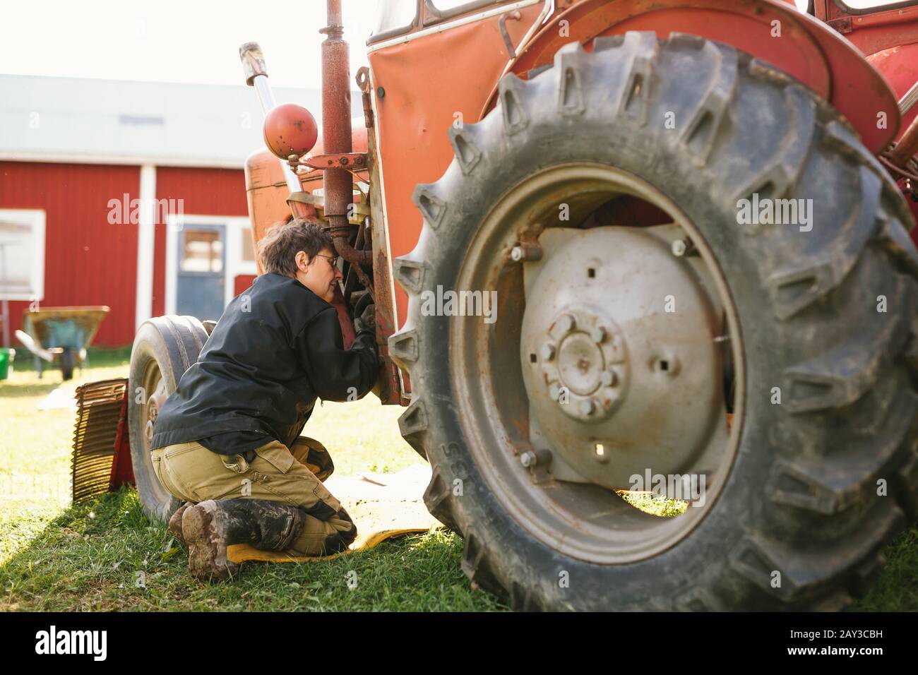 Woman with tractor hi-res stock photography and images - Alamy