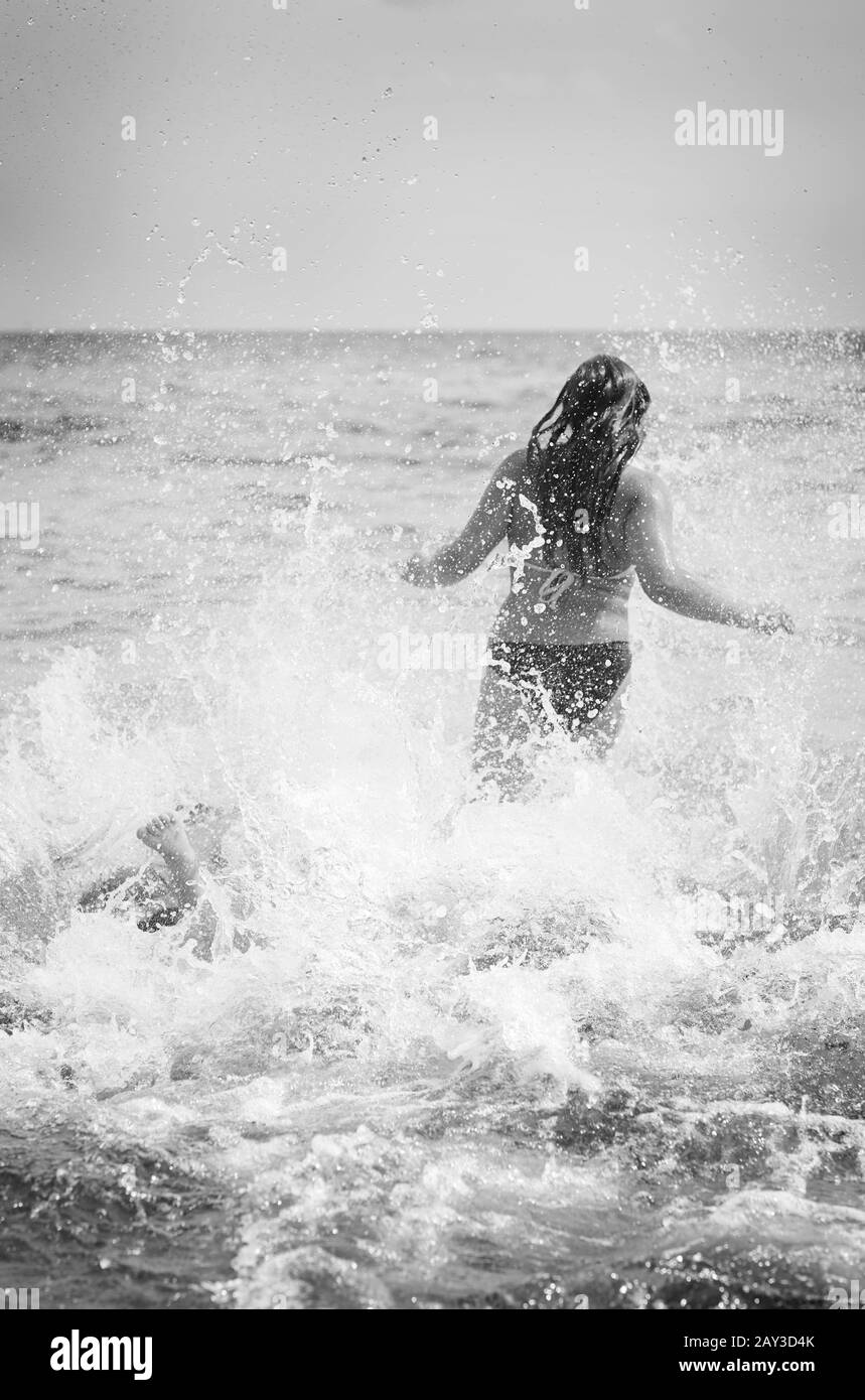 Girl running into sea Stock Photo - Alamy Girl running into sea Stock Photo - Alamy