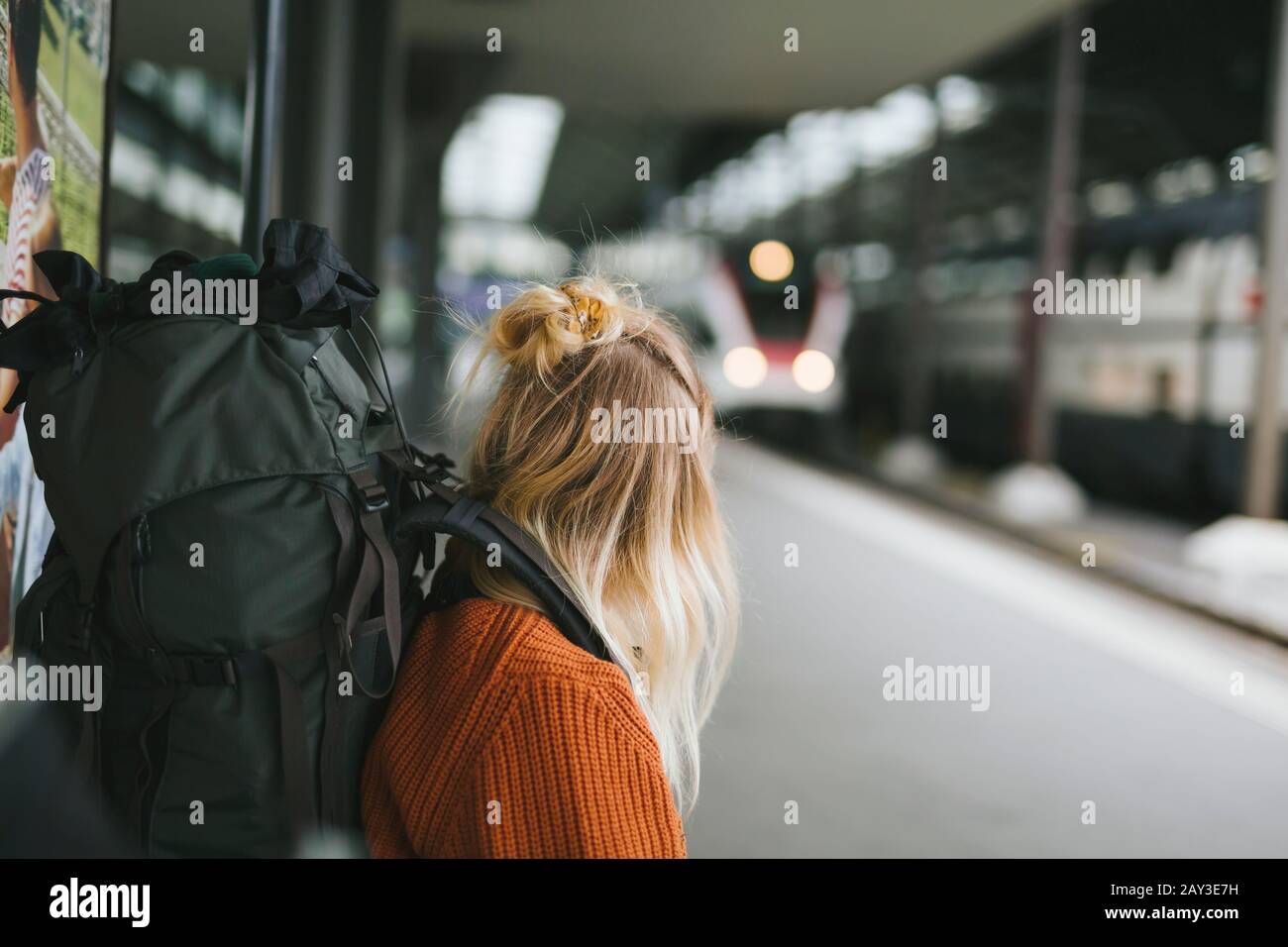 Woman on train station Stock Photo - Alamy