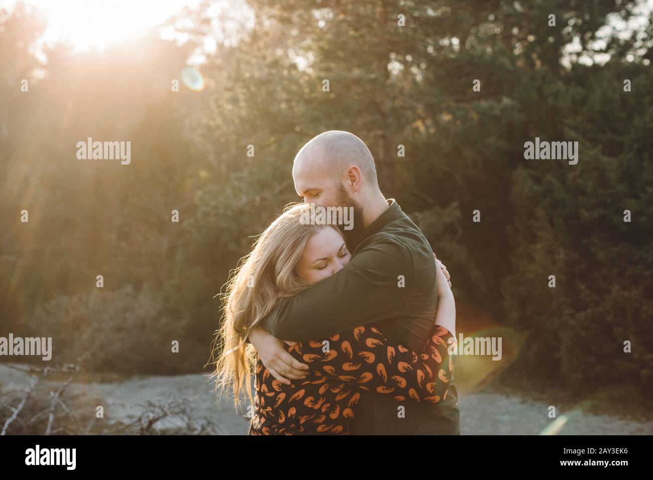 Couple hugging together Stock Photo - Alamy