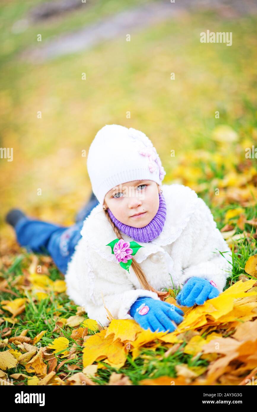 little girl in autumn forest Stock Photo - Alamy