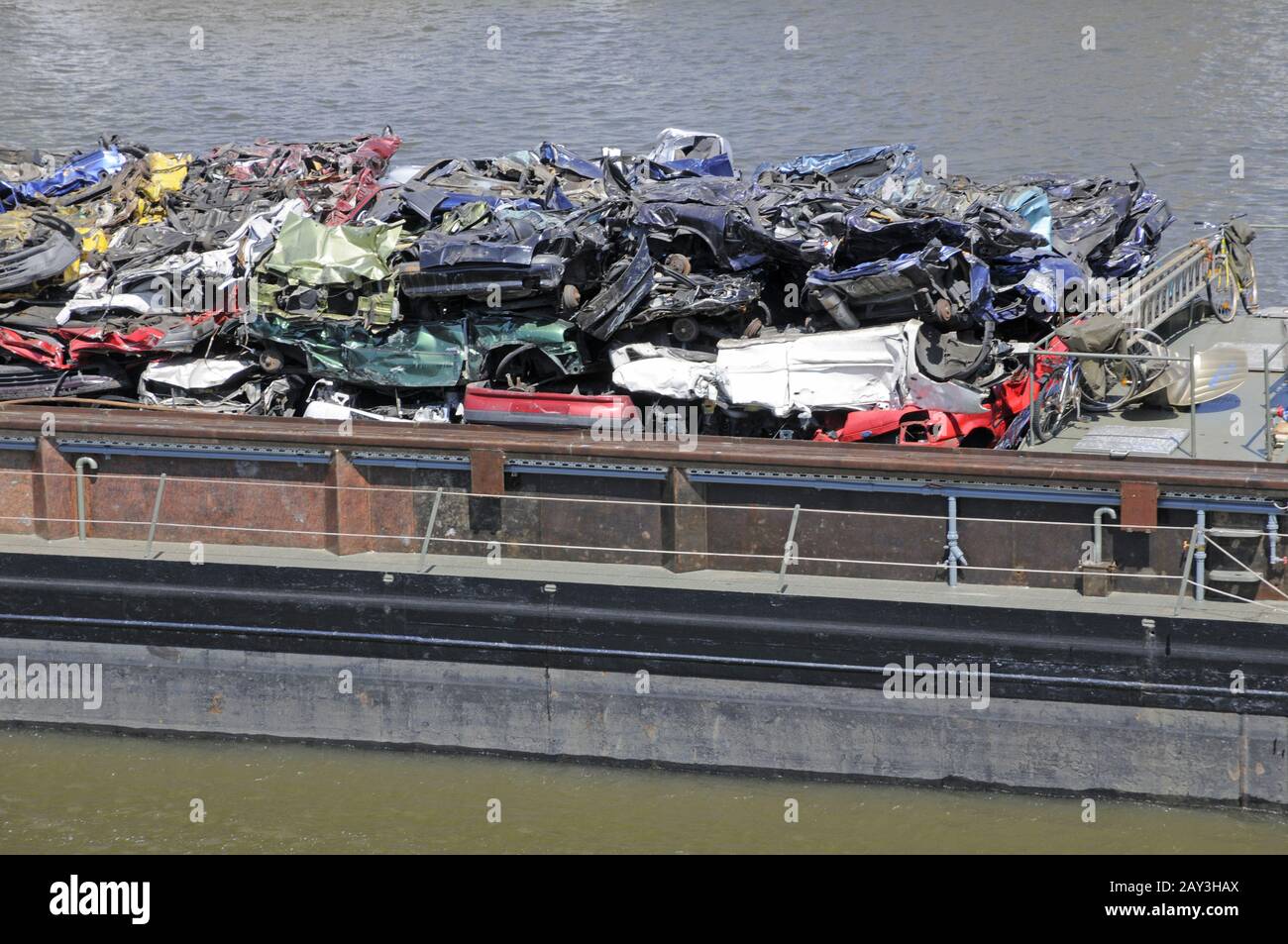 scrap metal on a barge Stock Photo - Alamy