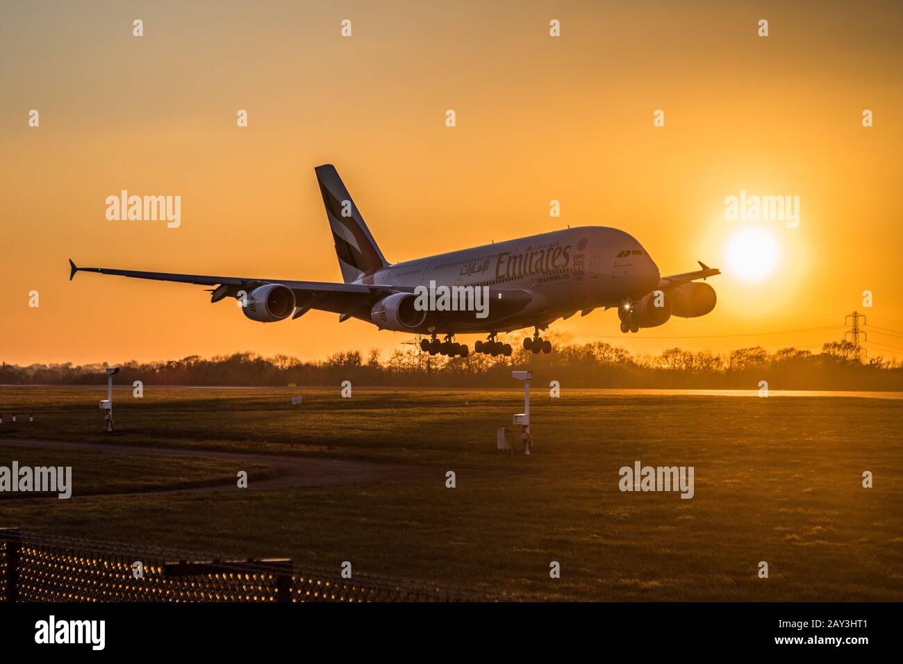 Emirates A-380 sunset Stock Photo - Alamy