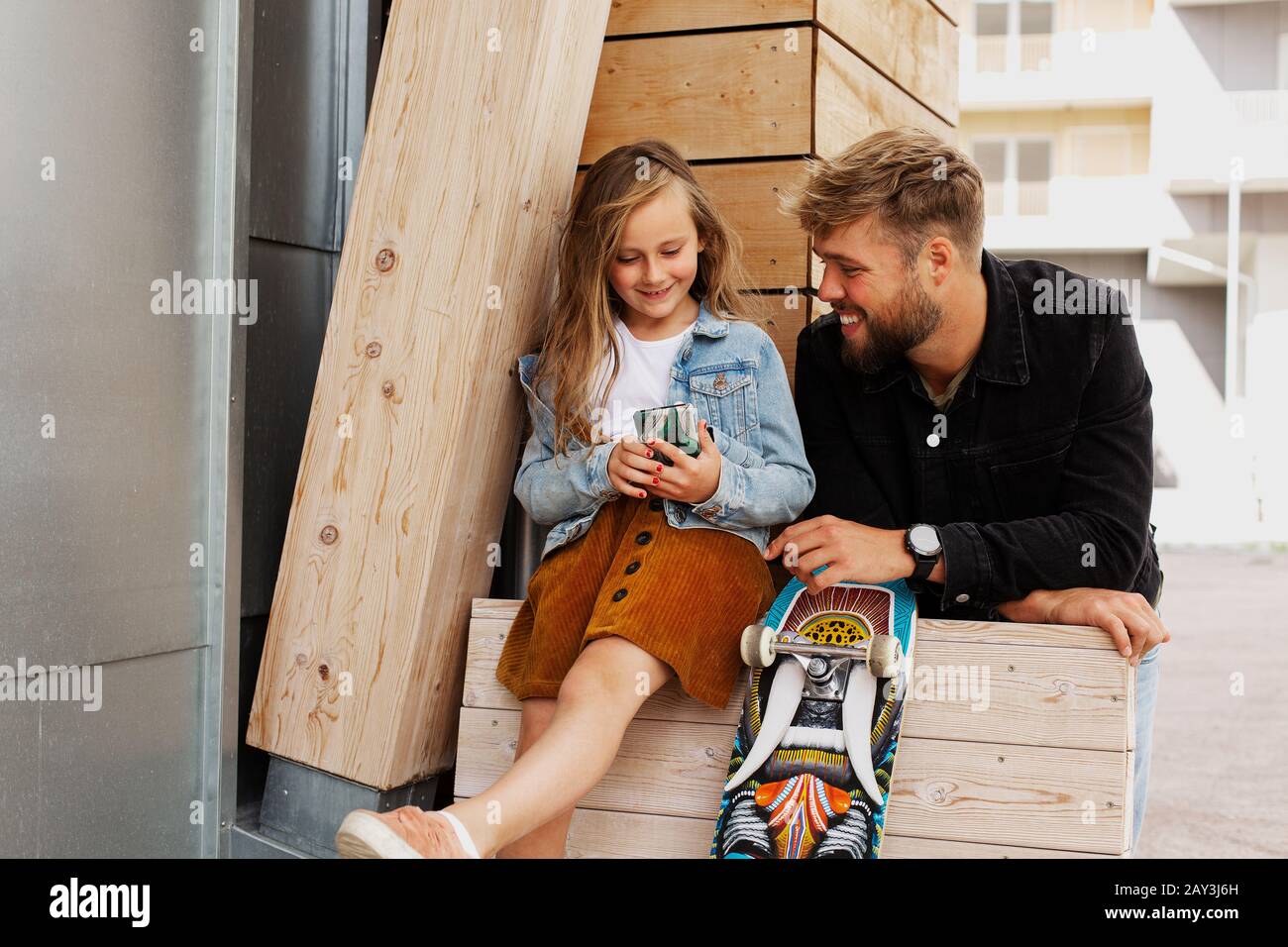 Positive father daughter looking phone hi-res stock photography and ...