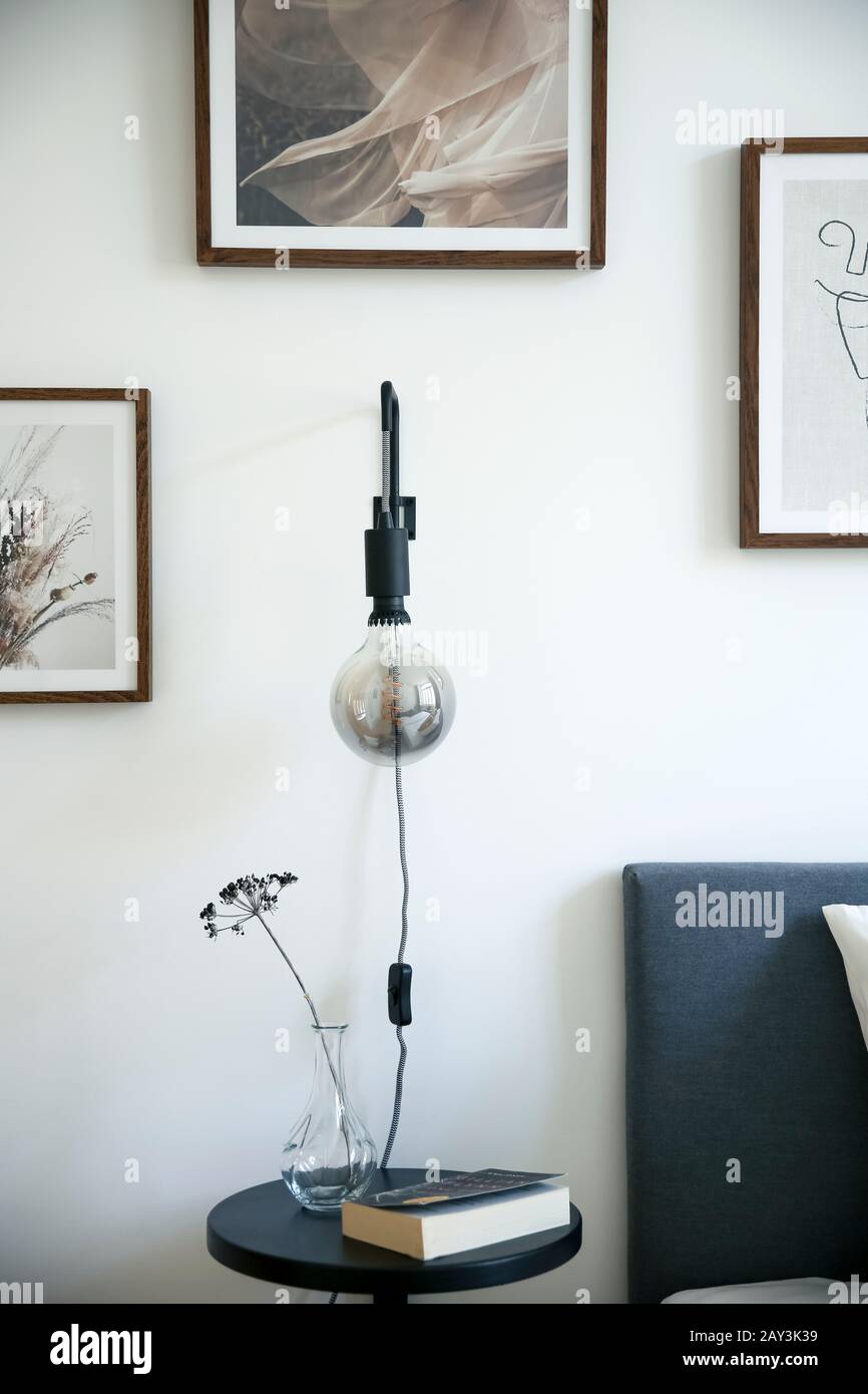 Light above side table Stock Photo - Alamy