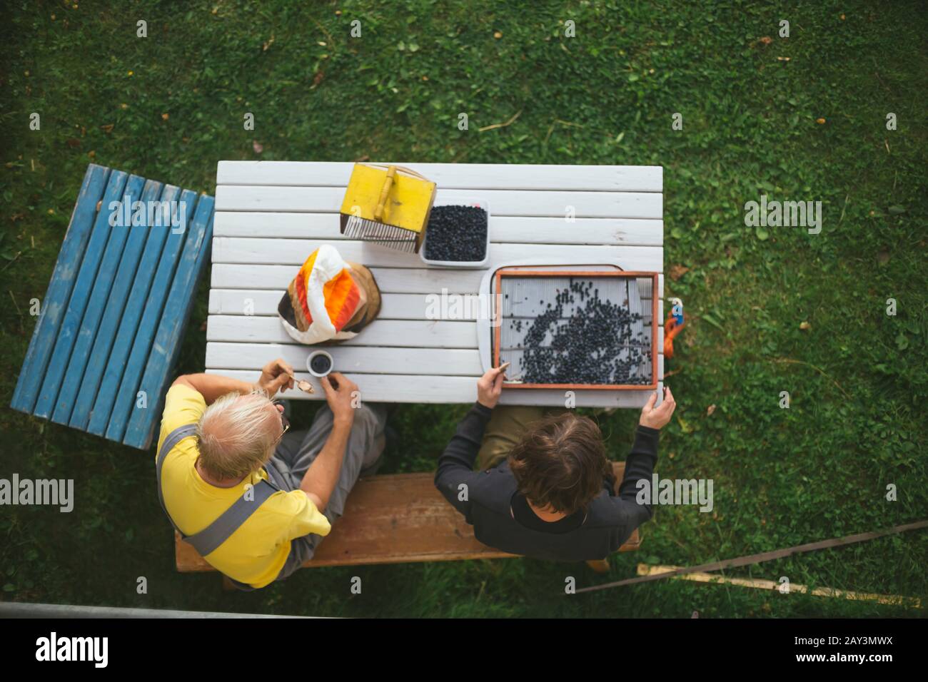 Couple sitting outside Stock Photo - Alamy