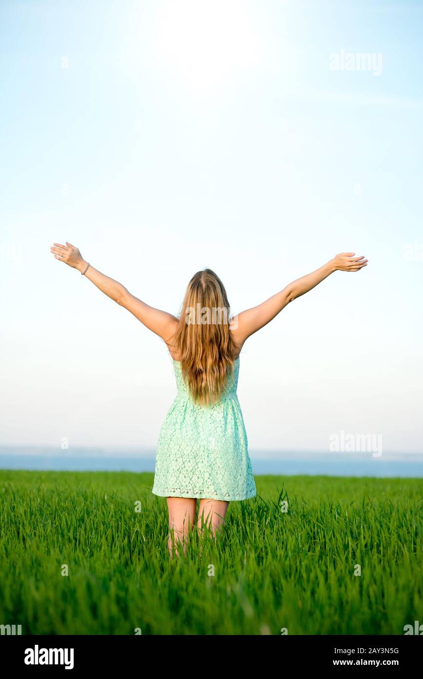 Happiness woman stay outdoor under sunlight of sunset Stock Photo - Alamy