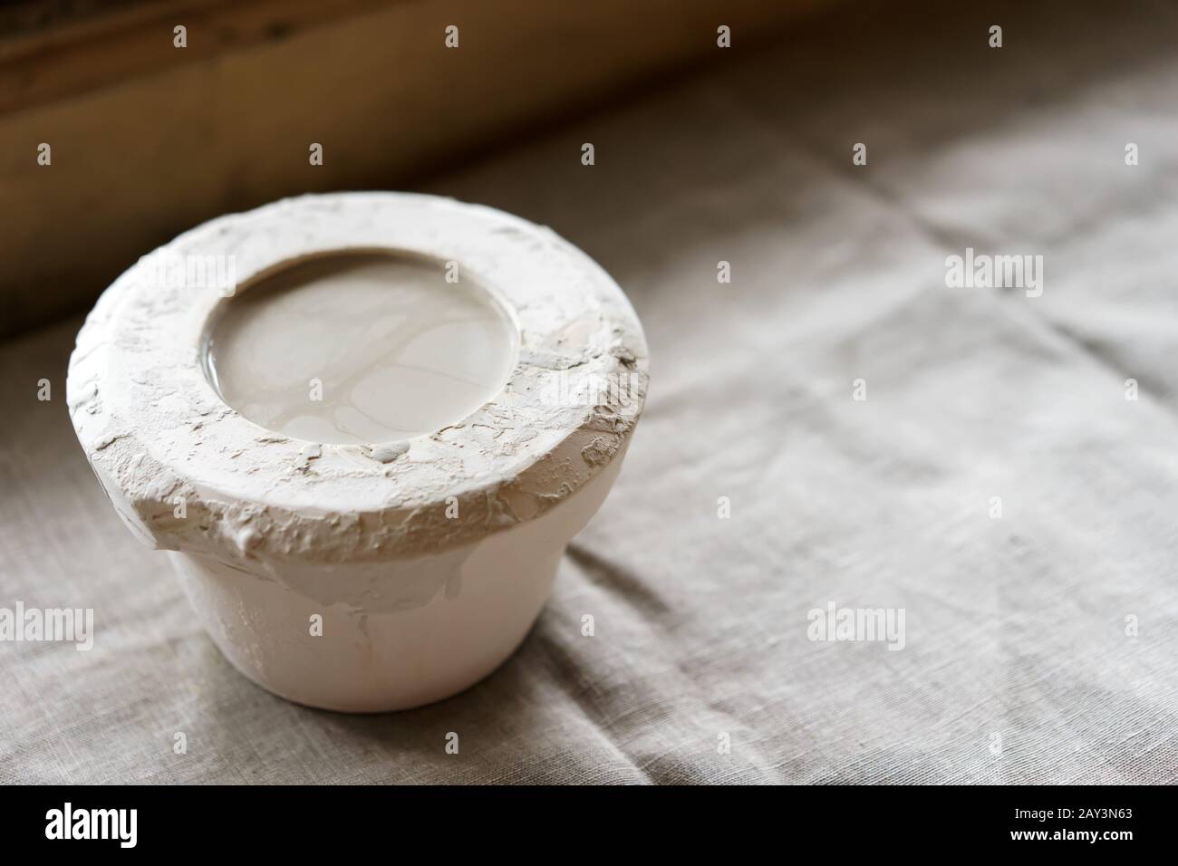 Mold for casting clay products with a mixture inside Stock Photo - Alamy
