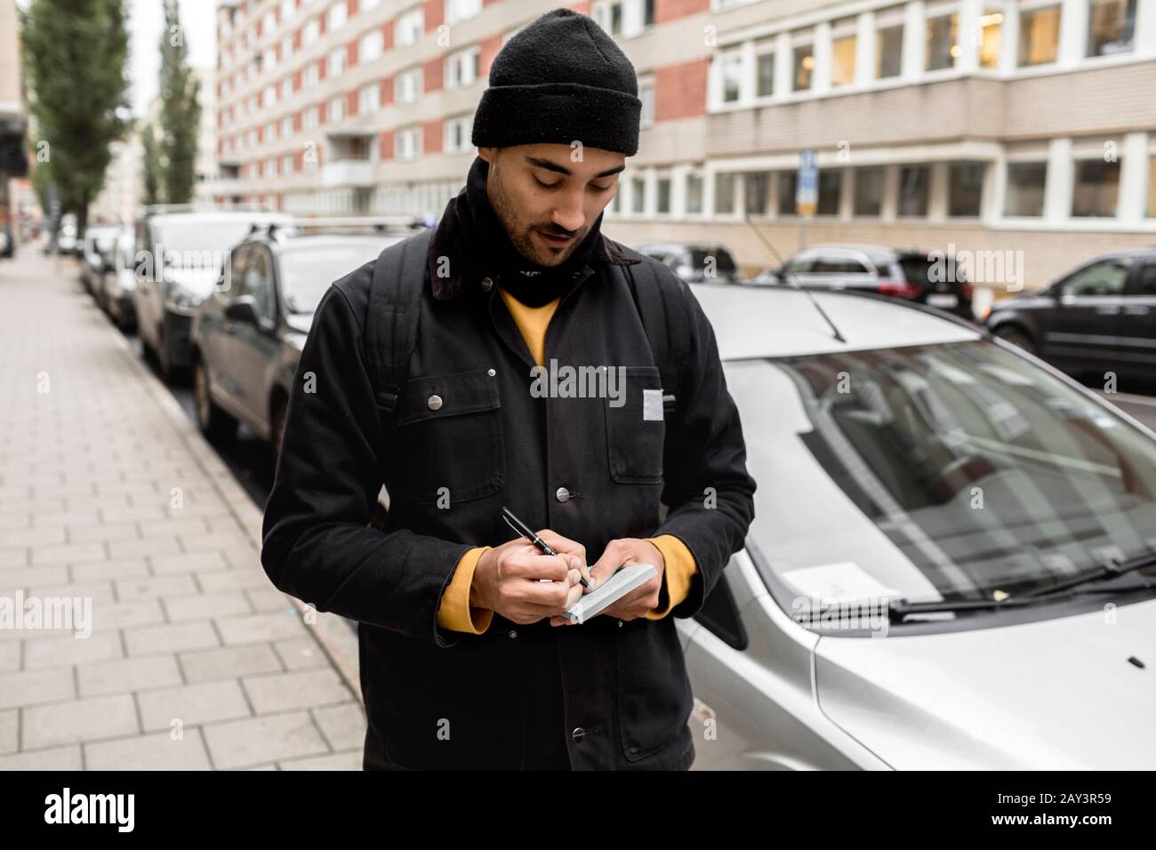 Man taking notes Stock Photo - Alamy