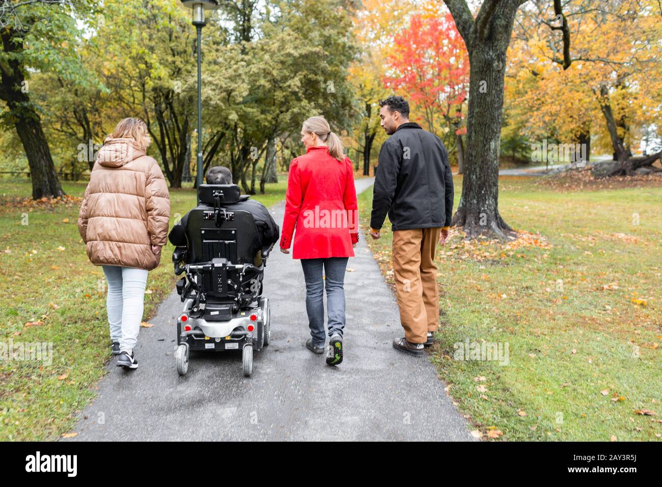Disability family walking park hi-res stock photography and images - Alamy