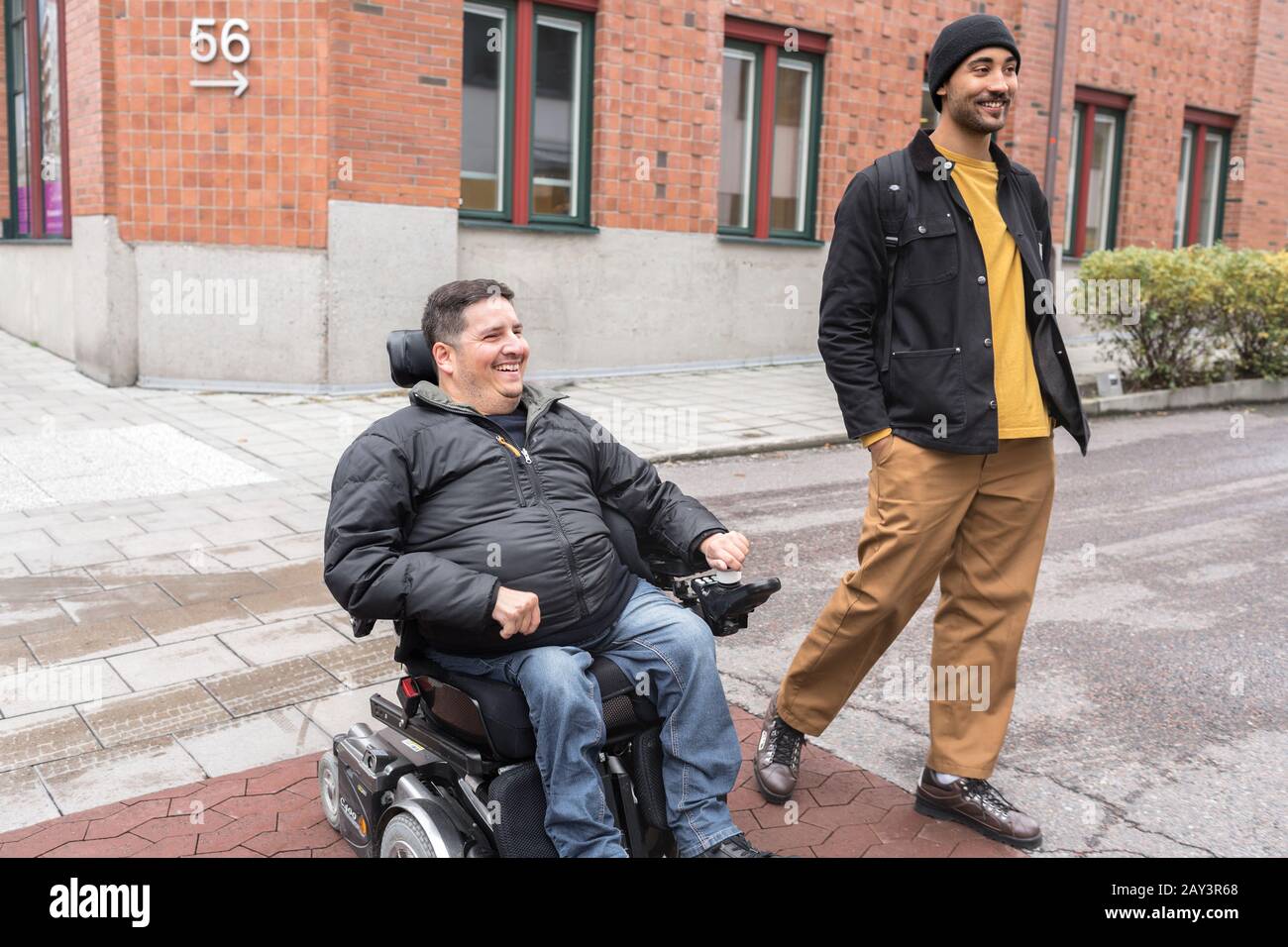 Men walking together hi-res stock photography and images - Alamy