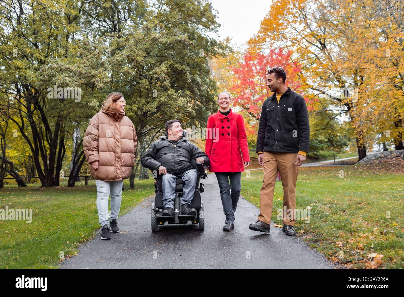 Friends walking together through park hi-res stock photography and ...