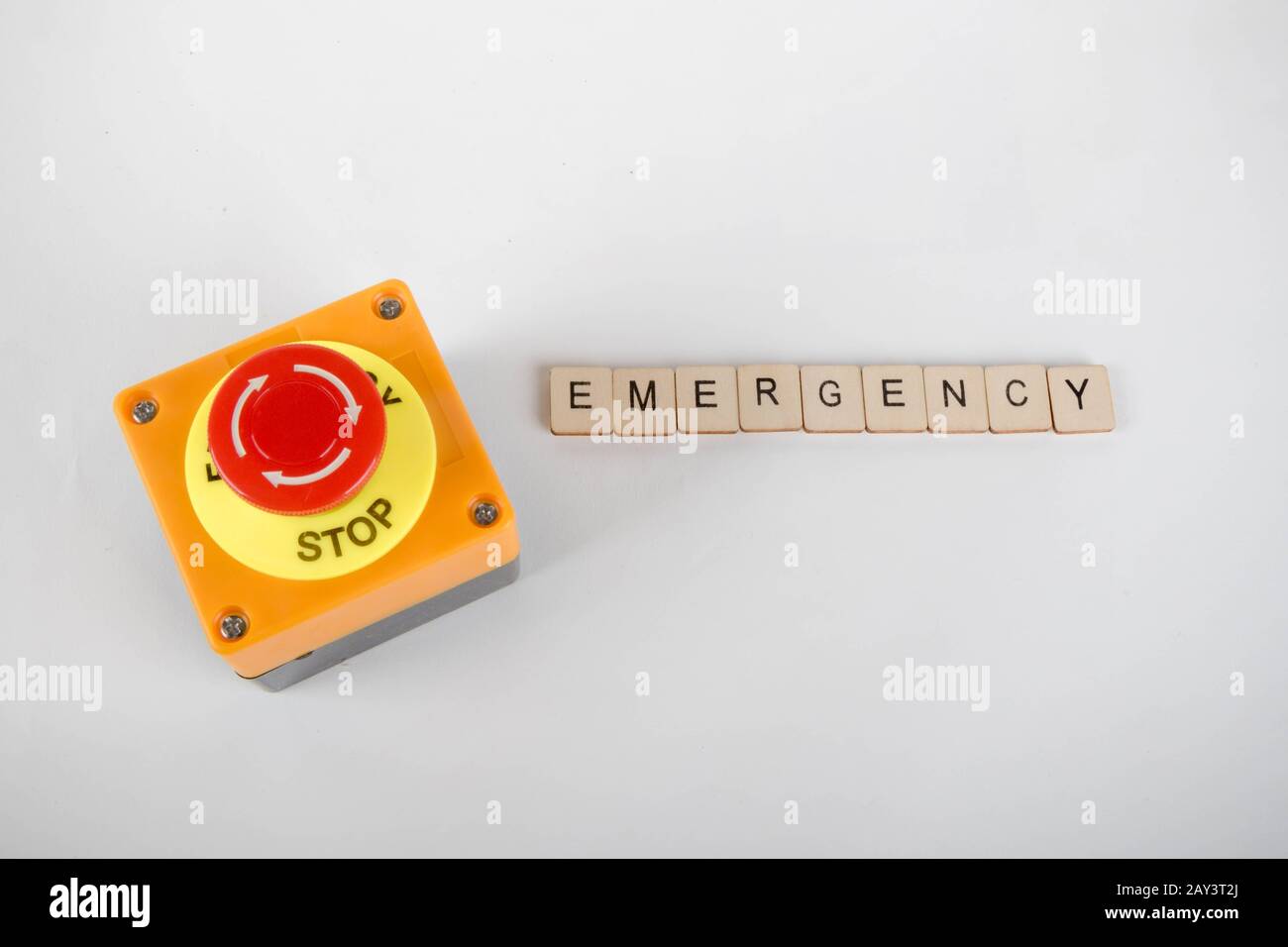 An industrial emergency stop button with a sign reading Emergency Stock ...