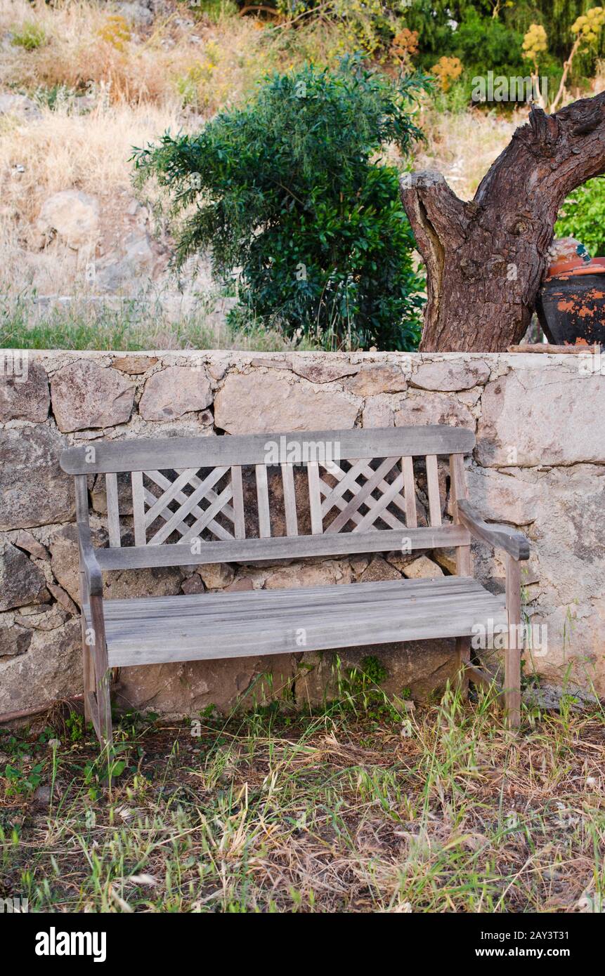 Wooden bench near flowers hi-res stock photography and images - Alamy