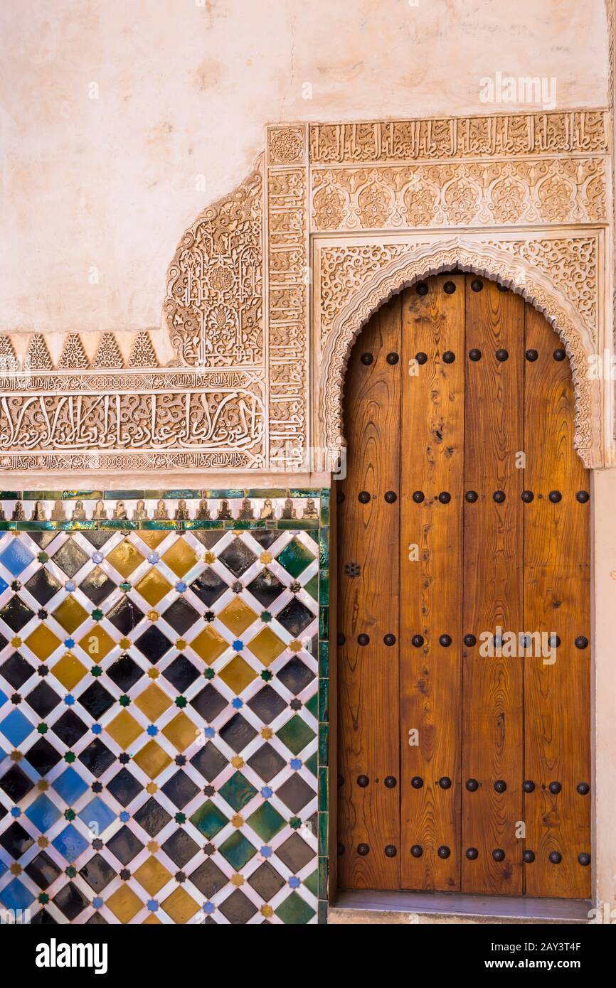 detail of Alhambra tiles on mosaic wall and door in the Courtyard of ...
