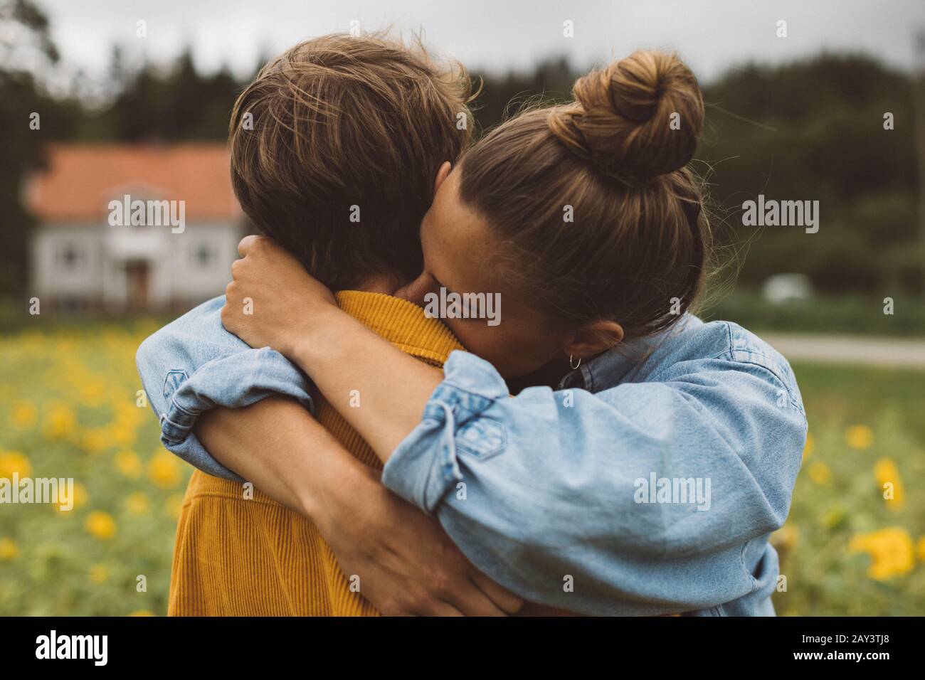 Female couple hugging Stock Photo - Alamy