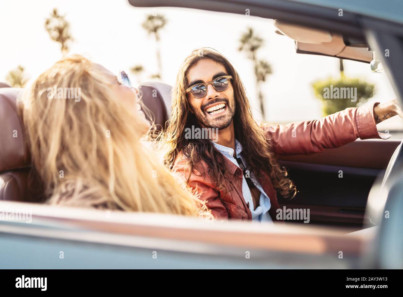 Happy young couple doing road trip in tropical city - Travel people ...