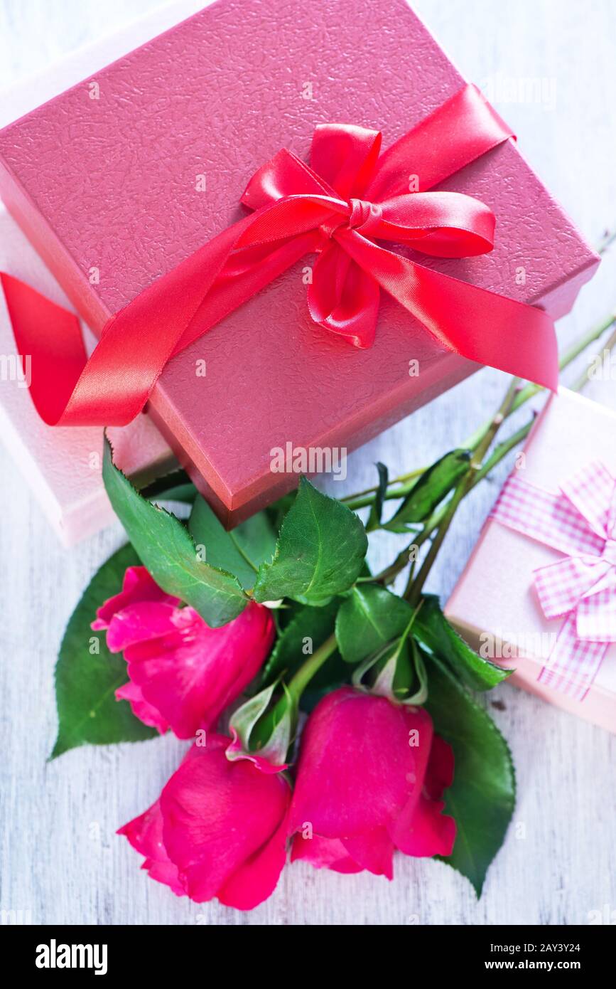 box for present and red roses Stock Photo - Alamy