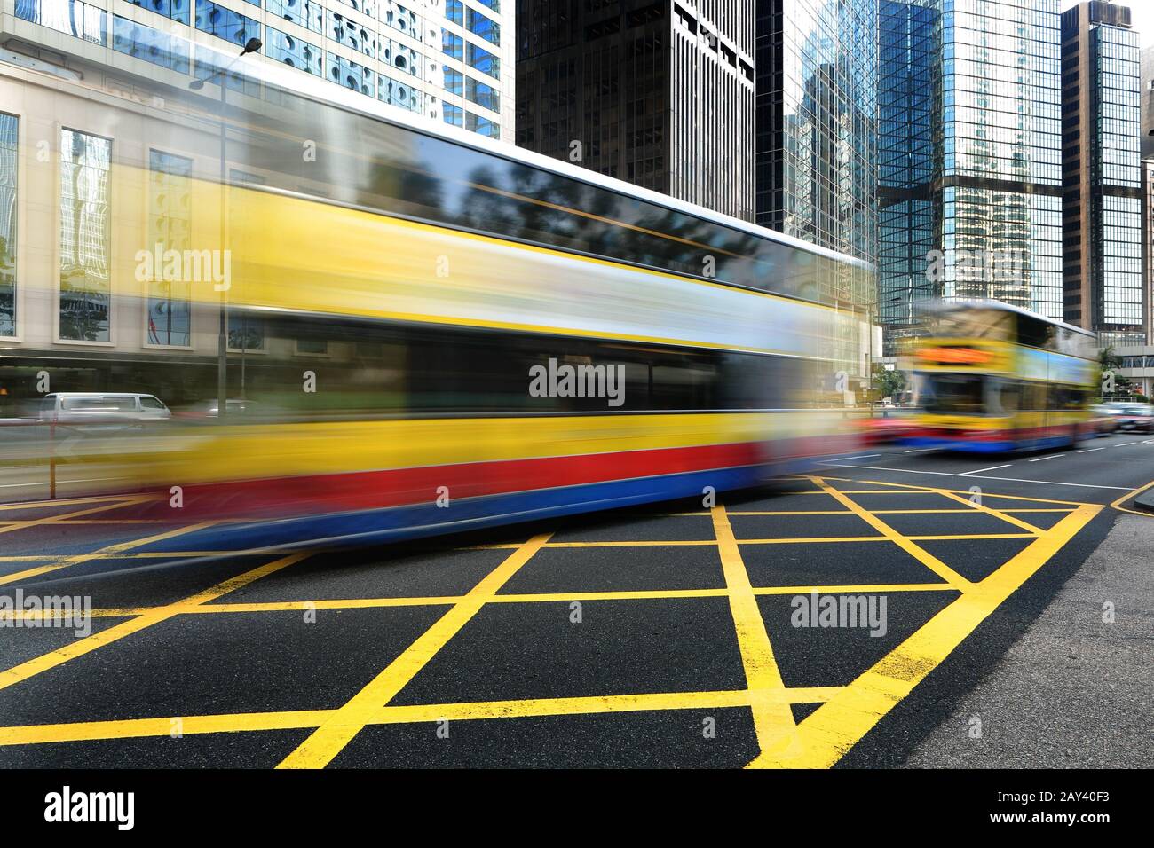 Bus speeding through the street Stock Photo - Alamy