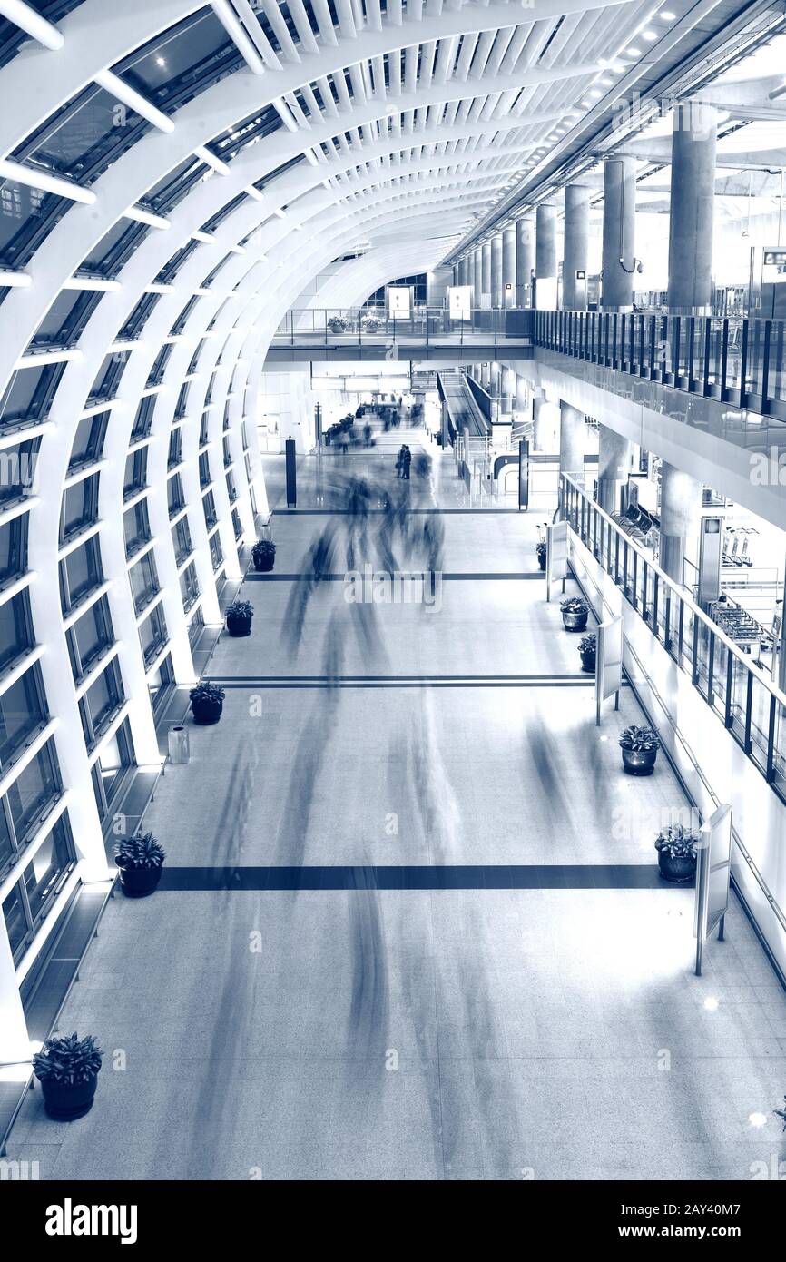 people moving blur in corridor Stock Photo - Alamy