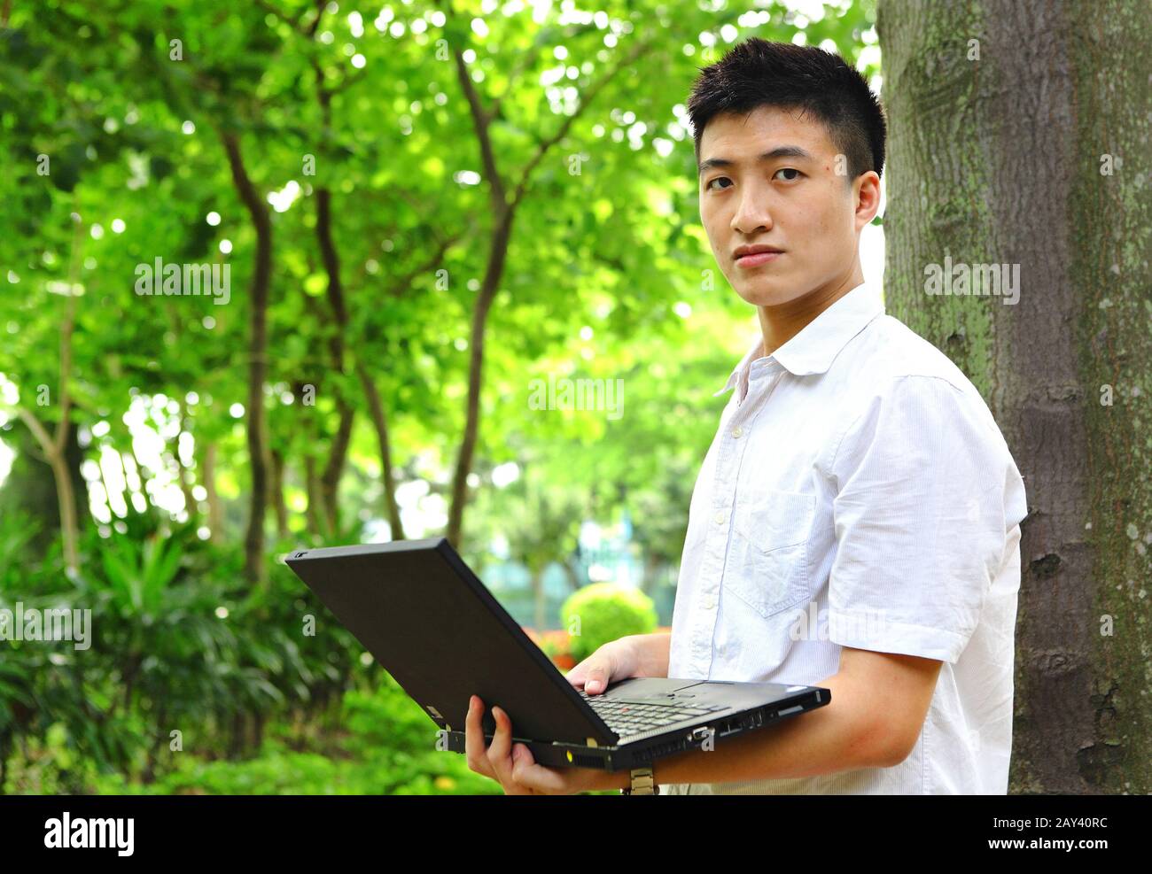 man using computer outdoor Stock Photo - Alamy