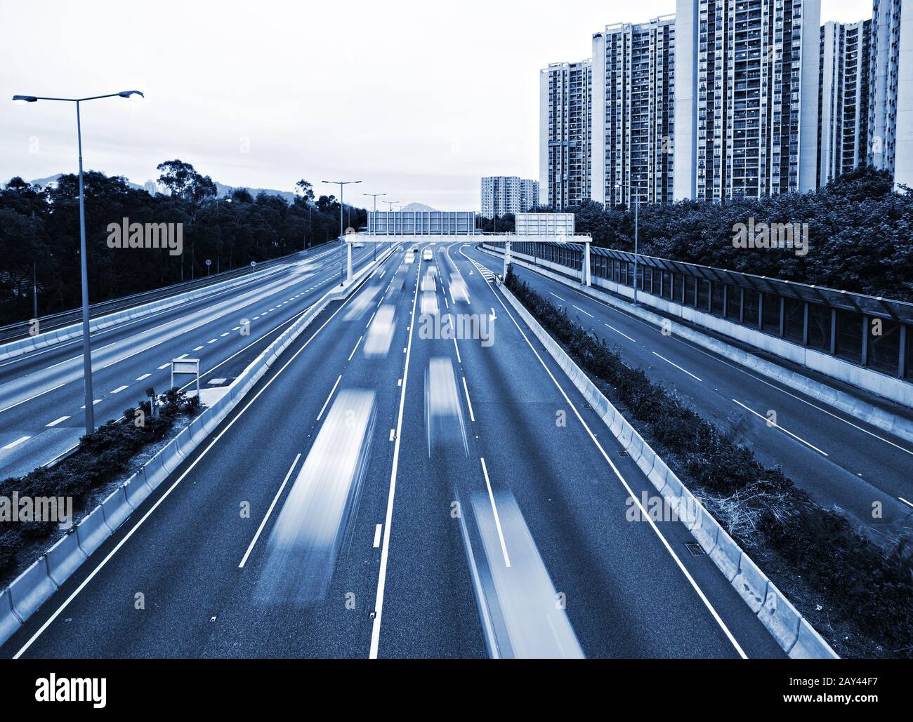 Traffic on highway in blue Stock Photo - Alamy