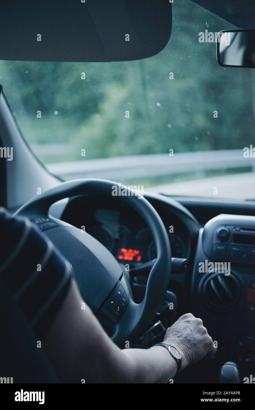 Drivers's hands on stearing wheel of a car Stock Photo - Alamy
